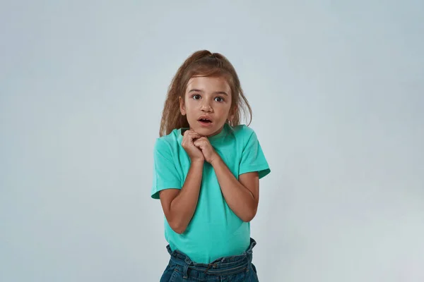 Scared little girl with open arms look at camera — Stock Photo ...