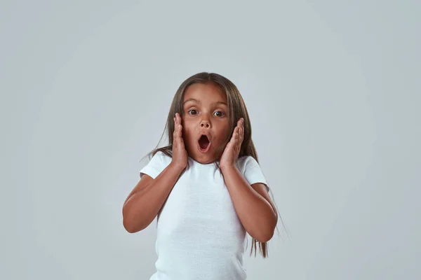 Scared little girl with open arms look at camera — Stock Photo ...