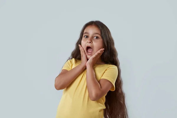 Scared little girl with open arms look at camera — Stock Photo ...
