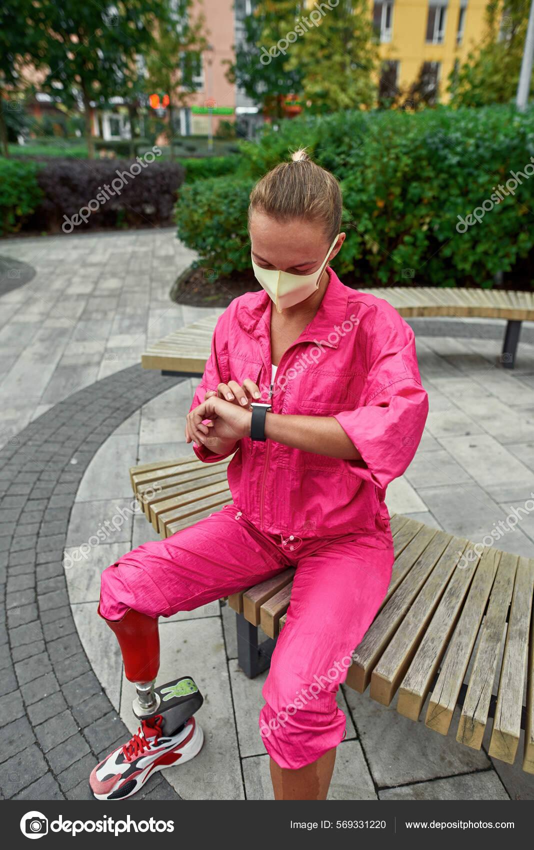 Girl has disability watch on smartwatch on bench Stock Photo by ...