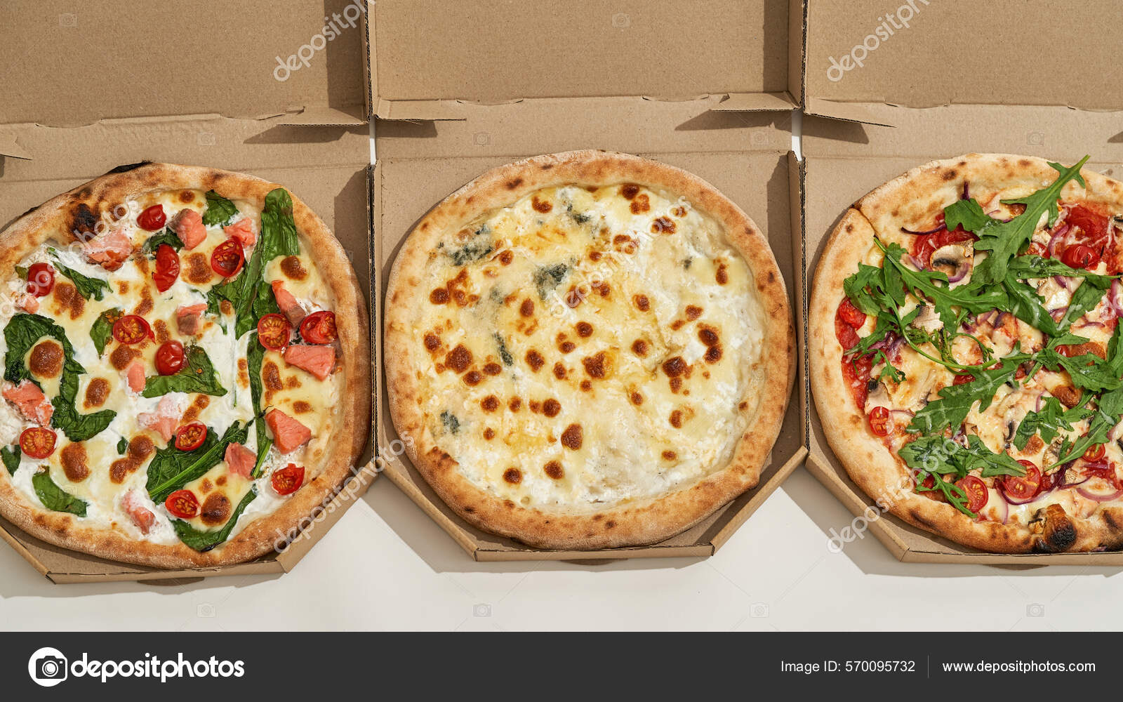 Partial of three pizzas in open cardboard boxes — Stock Photo ...