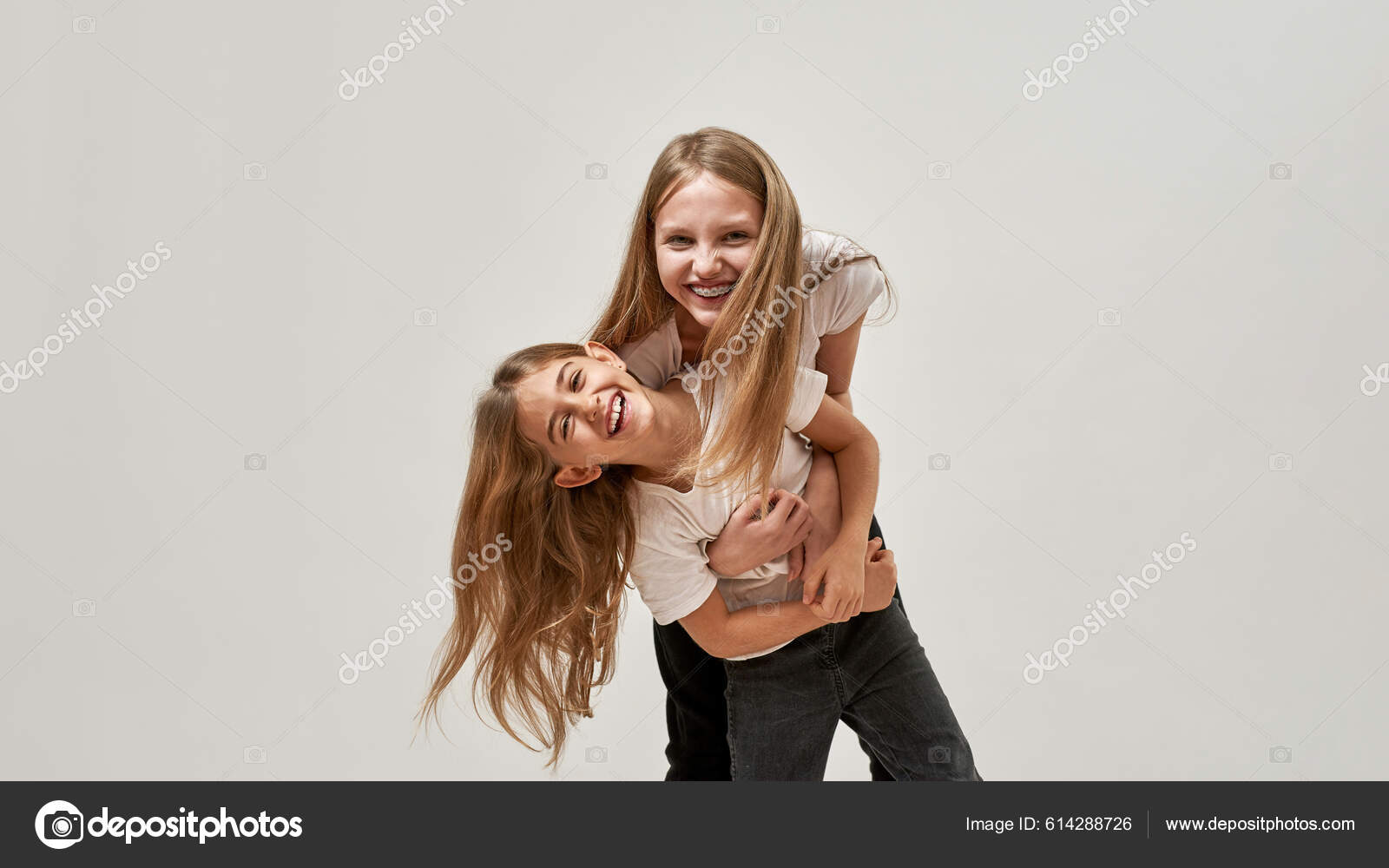 Teenage Girl Hugging Her Little Sister Cheerful European Sisters Zoomer ...
