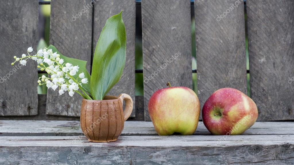 Red apples and lily of the valley flower — Stock Photo © ileana_bt ...