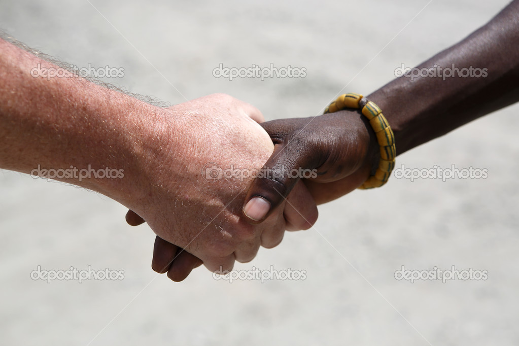 Handshake between a Caucasian and an African — Stock Photo © kb ...