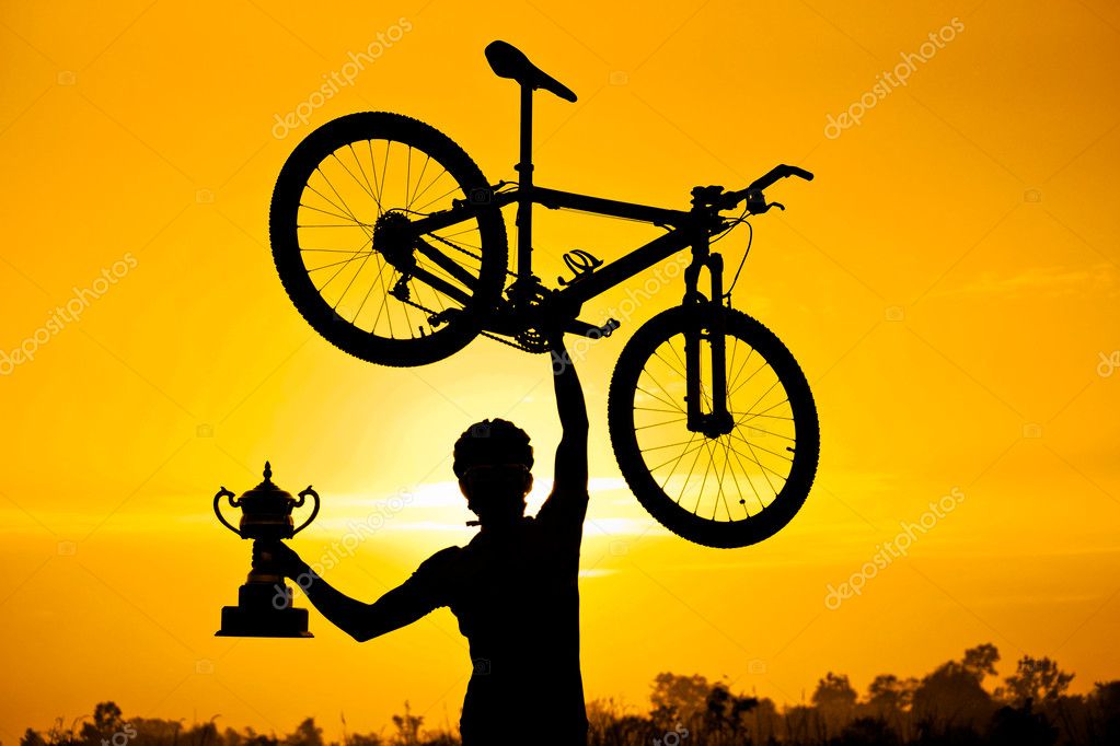Cyclist raising his mountain bike — Stock Photo © weerapat #39731297