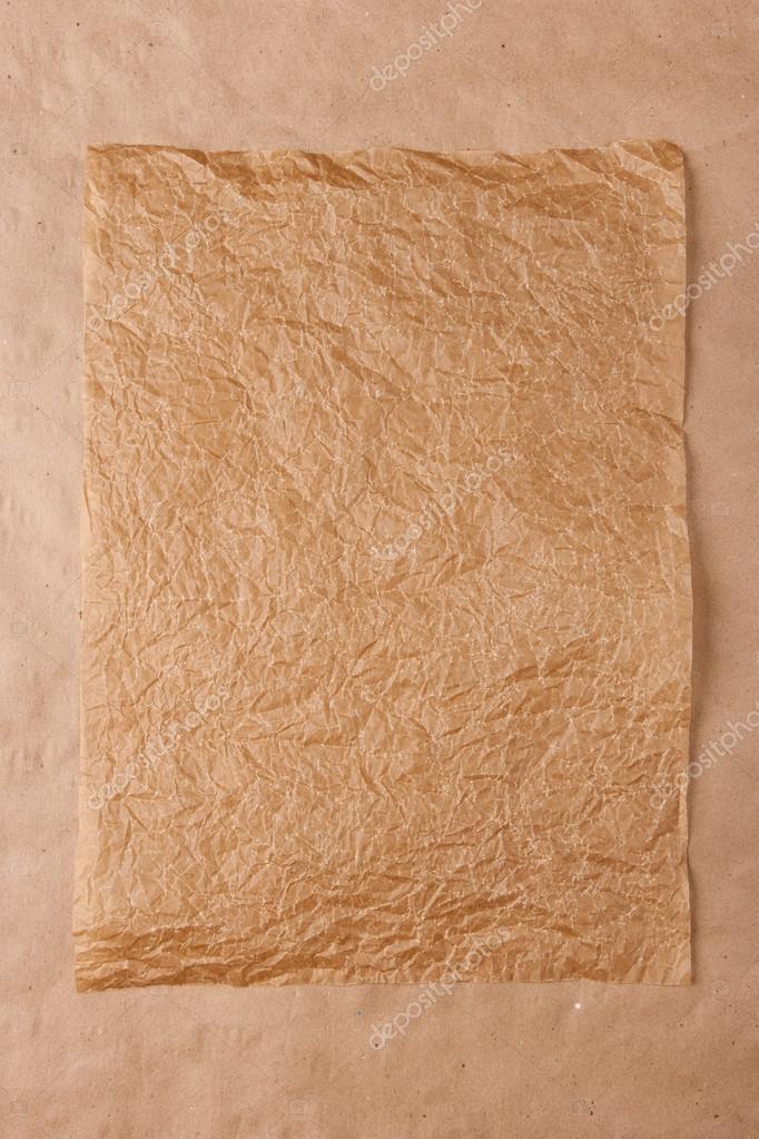 Crumpled sheet of parchment on packing paper Stock Photo by ©milarka ...