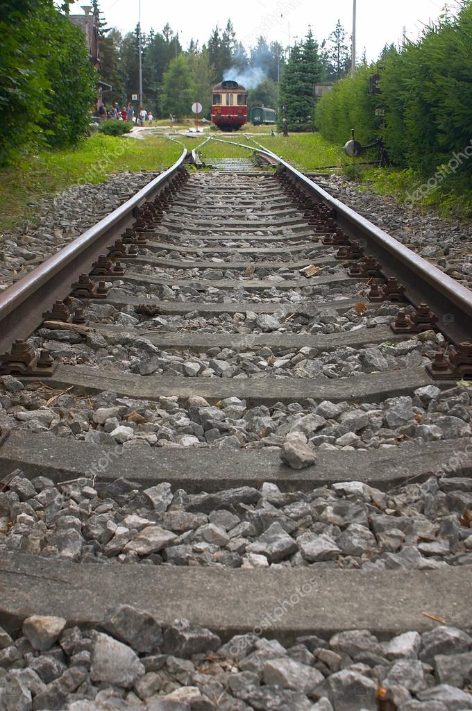 Train tracks with locomotive Stock Photo by ©300dpi 39966599