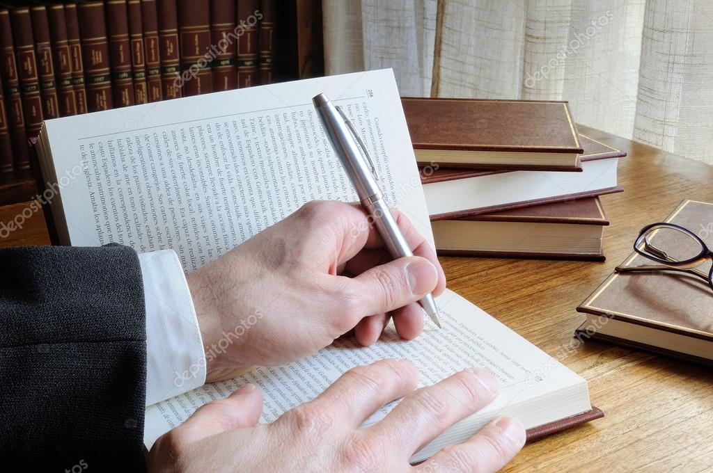 Men seeking references in a book — Stock Photo © davizro #41689853