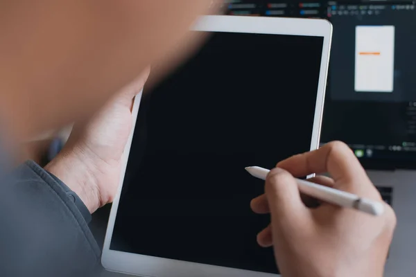 Mockup image of business man, website designer using stylus pen touching blank screen digital ...