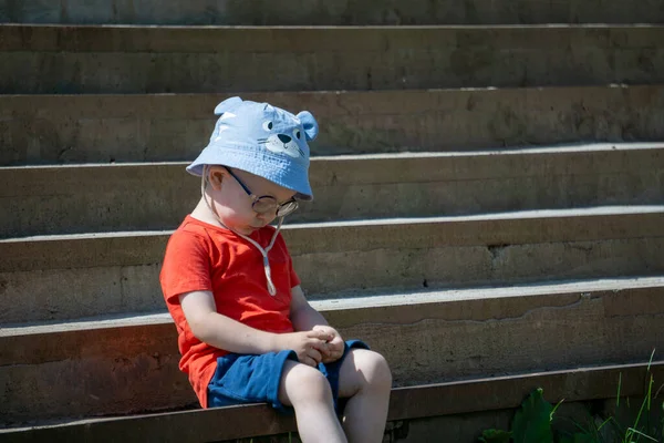 Boy sitting steps Stock Photos, Royalty Free Boy sitting steps Images ...