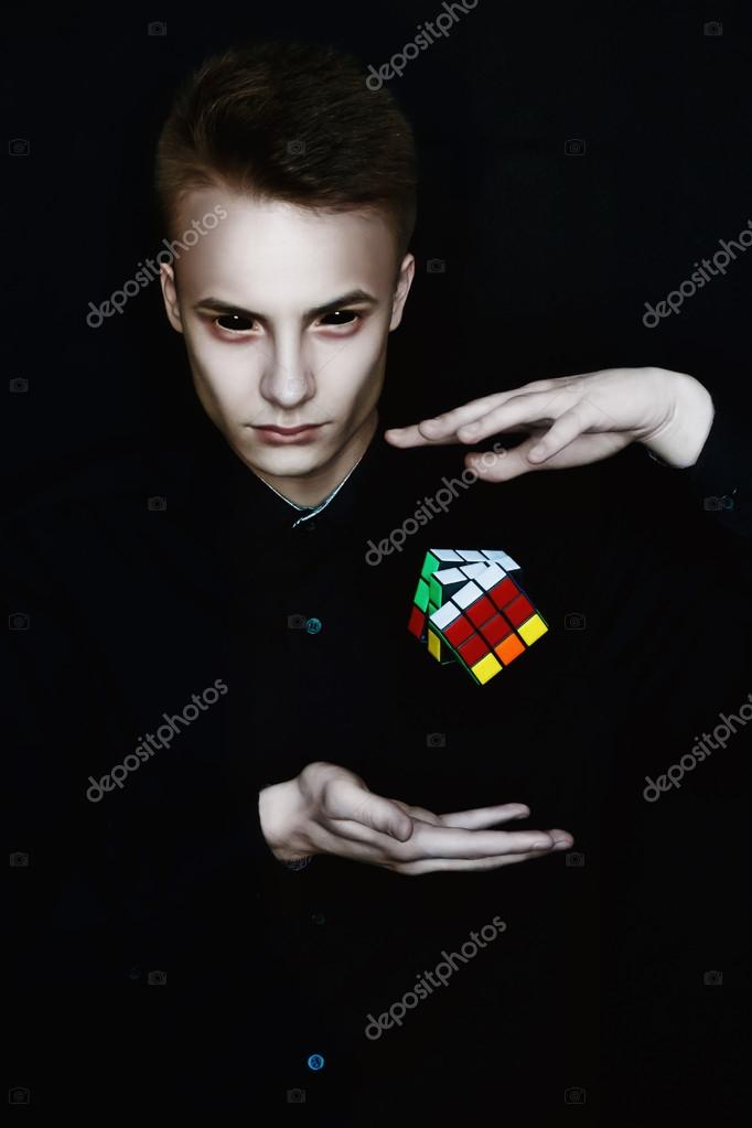 Boy with demon eyes and Rubik's cube – Stock Editorial Photo © volhanna ...