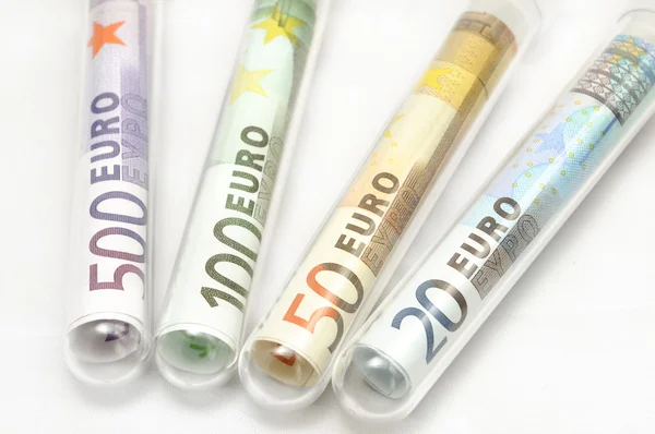 Euro banknotes in test tubes — Stock Photo © avarand #38384681