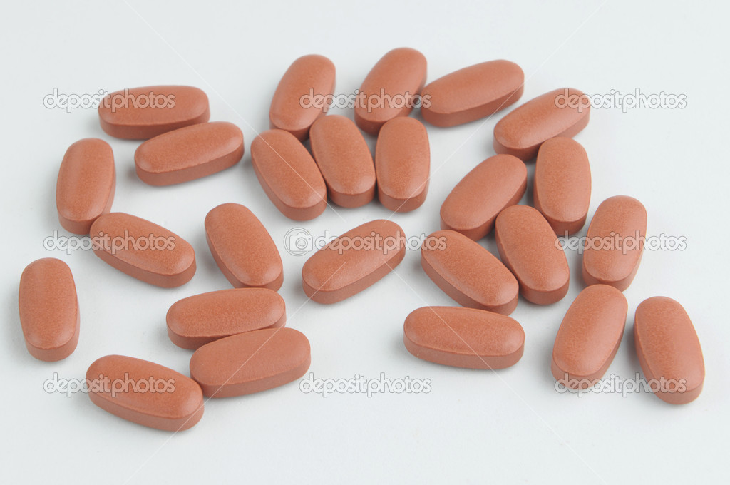 Brown pills and drugs Stock Photo by ©avarand 38963493