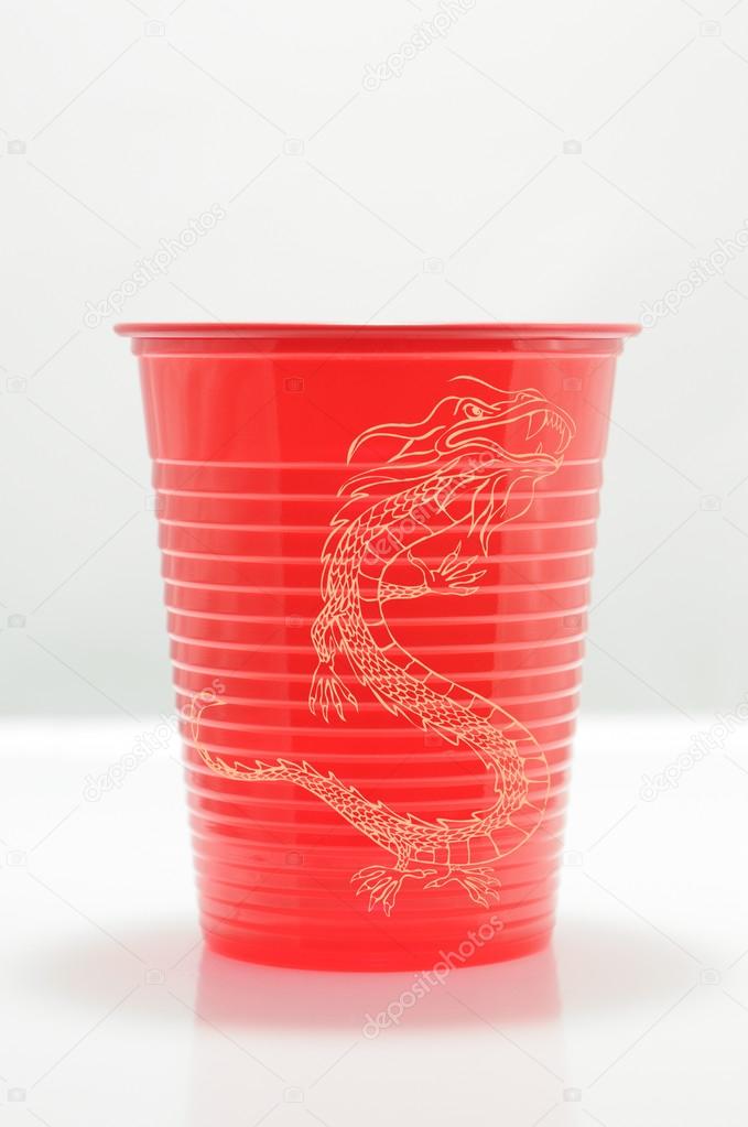 Red plastic cup with dragon — Stock Photo © avarand #44120779