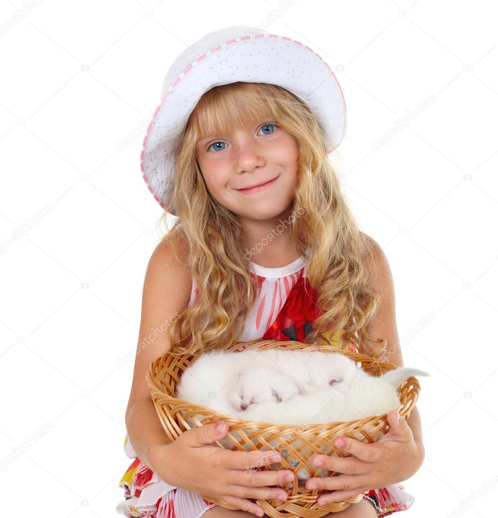 Cute little girl holding a basket with little cats isolated on white ...