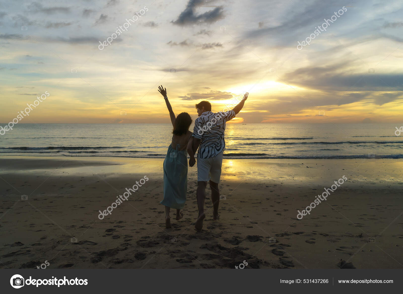 Romantic Asian Couple Standing Holding Hand Enjoying Beautiful Sunset