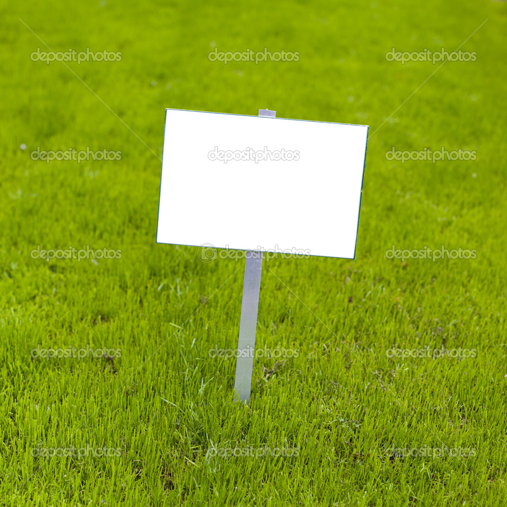 Sign on grass whith isolated space for caption — Stock Photo ...