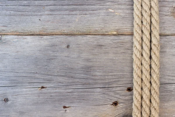 Rope frame and wood background — Stock Photo © DarkBird #32544409