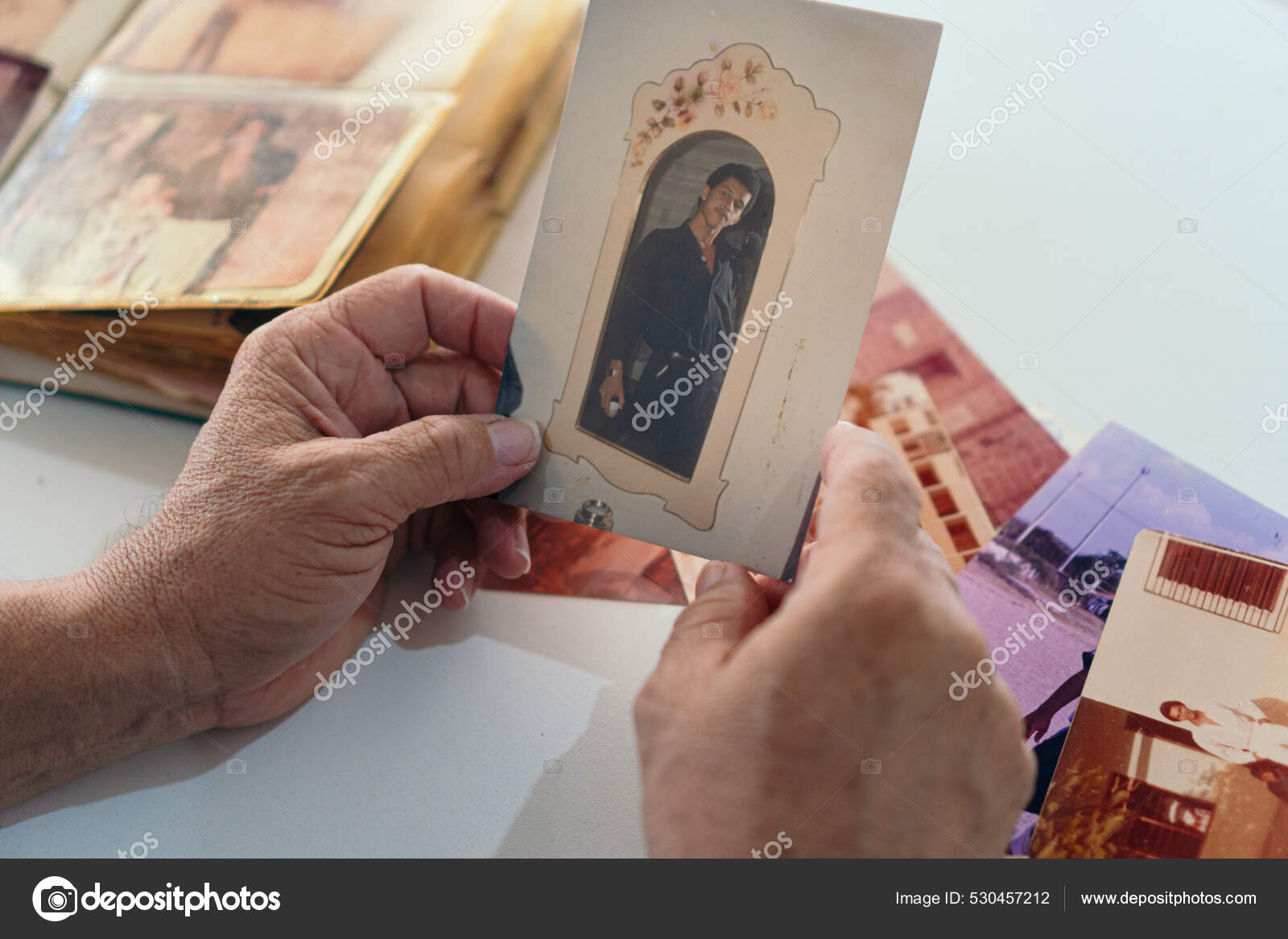 Older Man's Hands Looking Old Photograph — Stock Photo © HectorPertuz ...