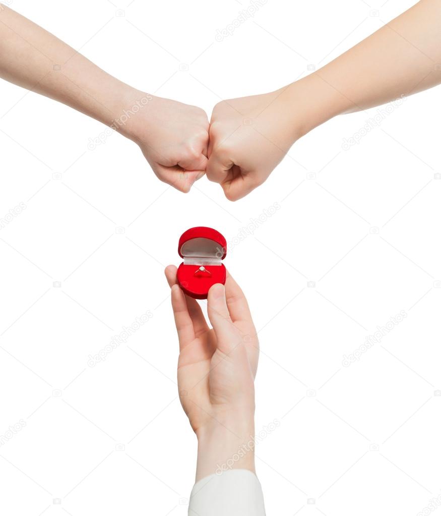 Two women hands fighting for ring being held by man Stock Photo by ©o ...
