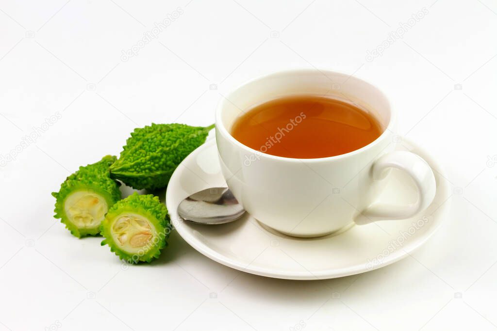 Bitter gourd or bitter melon tea in ceramic cup isolated on white ...