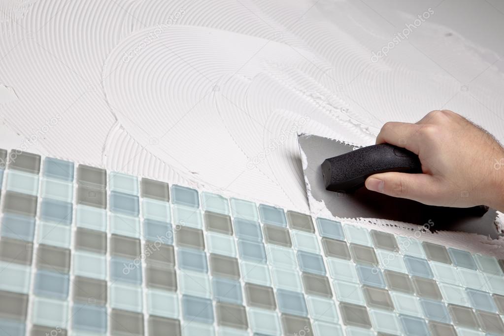 Man Tiling — Stock Photo © derek@hatfielddesign.com #46661543