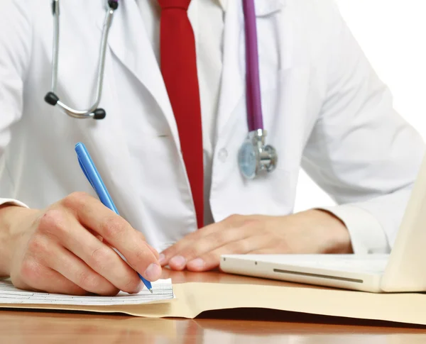 Medical doctor writing a note — Stock Photo © odua #11486911