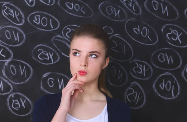 Thinking young woman with yes or no choice on grey background. - Stock ...