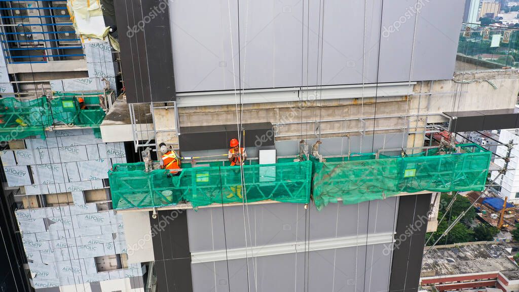Suspended platform, construction cradle hanging on building ...