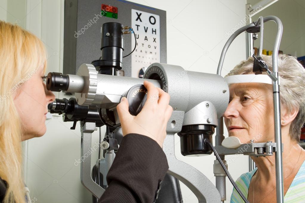 Lady having eye test examination — Stock Photo © Jamstock #41868731