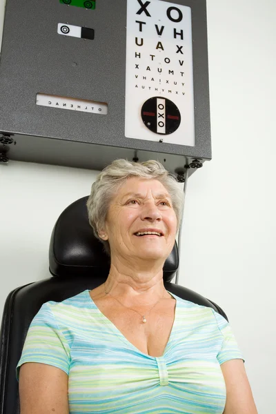 Lady having eye test examination — Stock Photo © Jamstock #41872433