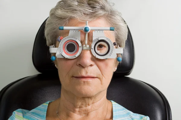 Lady having eye test examination — Stock Photo © Jamstock #41868731
