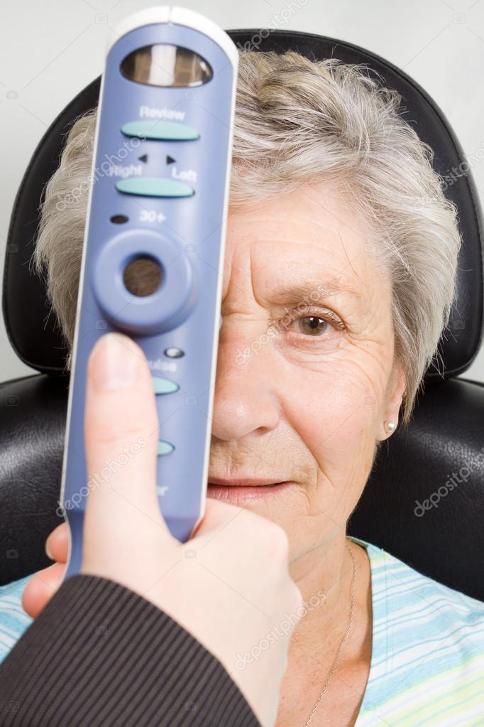 Lady having eye test examination — Stock Photo © Jamstock #41872433