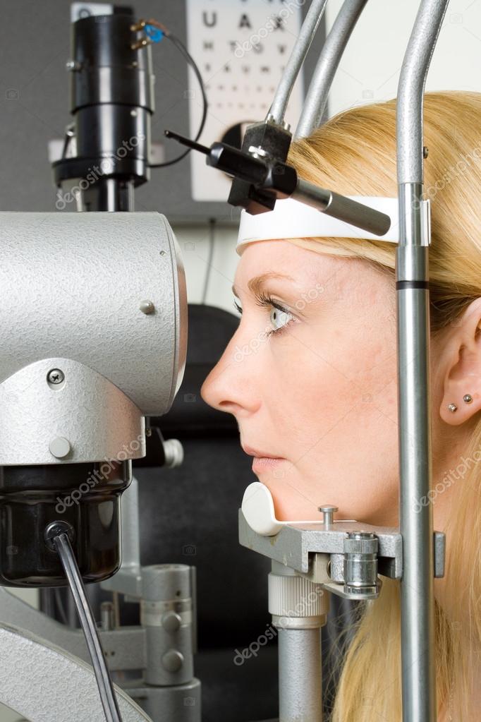Young woman having eye test — Stock Photo © Jamstock #41873739