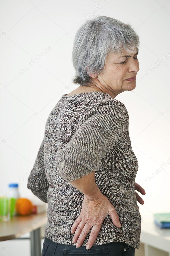 LOWER BACK PAIN IN ELDERLY PERS. Stock Photo by ©imagepointfr 42556503
