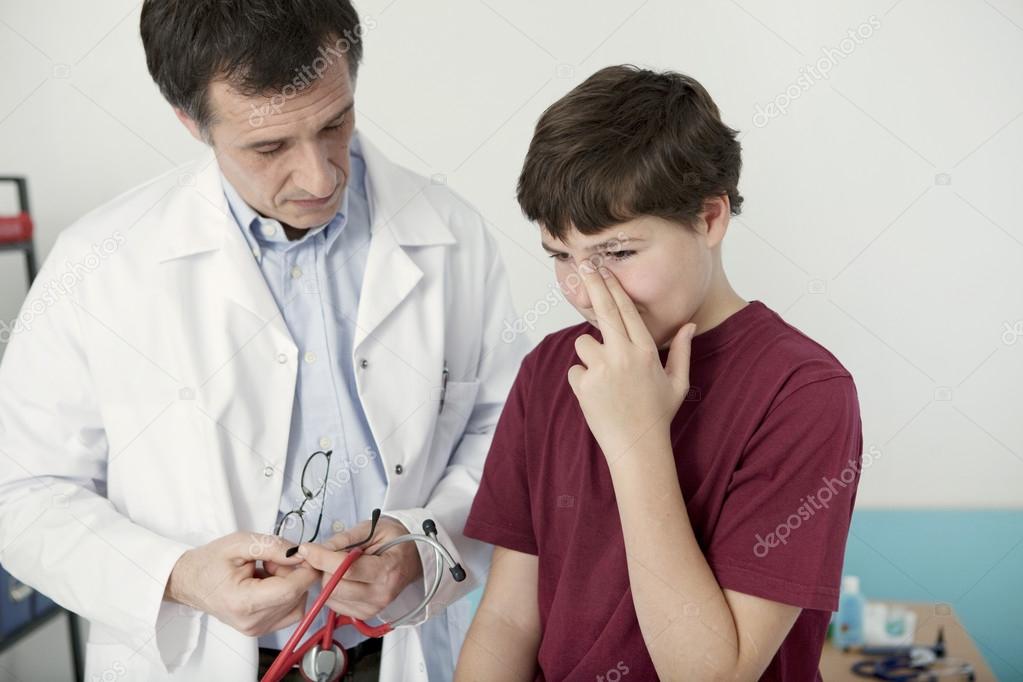 ENT examines a boy Stock Photo by ©imagepointfr 44402501