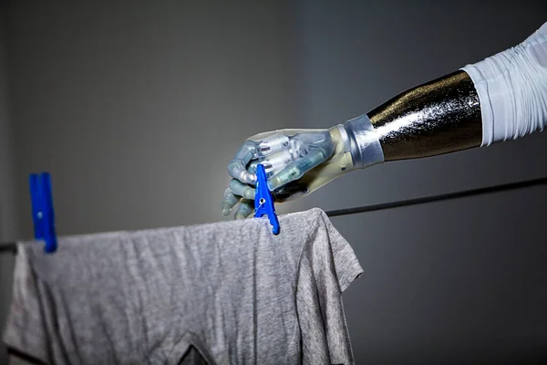 Person equipped with a robotic arm prosthesis. - Stock Image - Everypixel