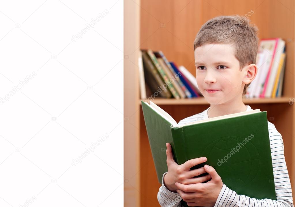 Boy holding book Stock Photo by ©anrymoscow 46643089