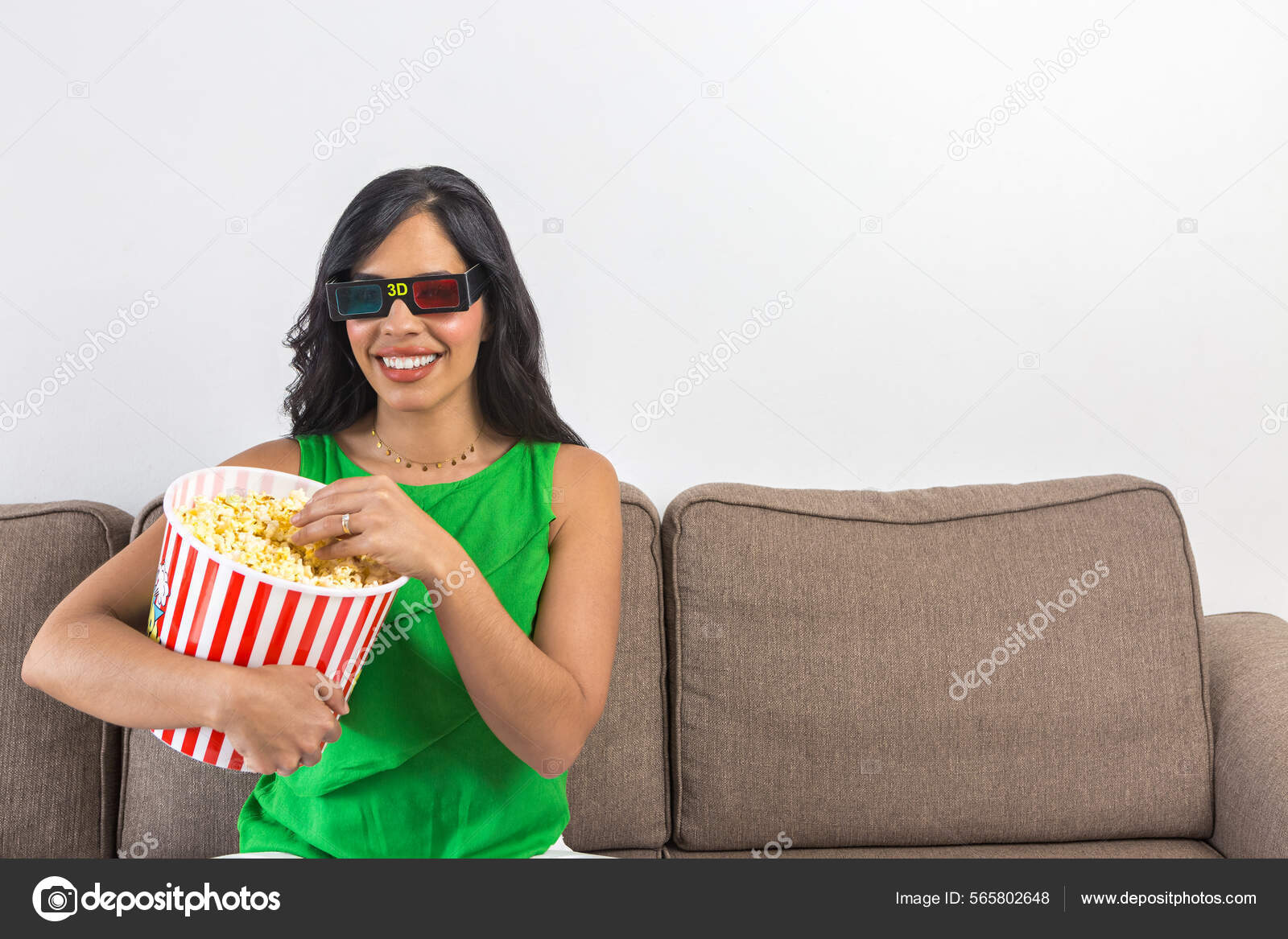 Glad Hispanic Female Glasses Taking Popcorn Bucket Smiling While ...