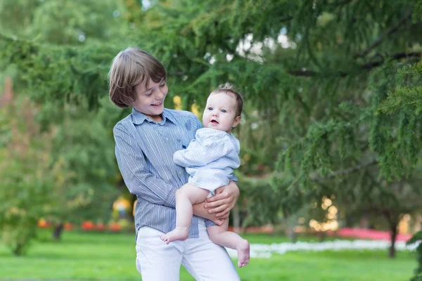 Brother and sister in a park - Stock Image - Everypixel