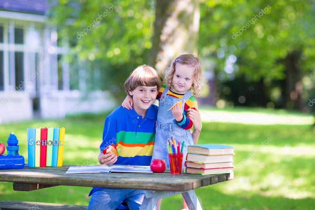Two kids in a school yard Stock Photo by ©FamVeldman 51344091