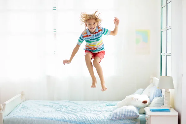 Child jump bed Stock Photos, Royalty Free Child jump bed Images ...