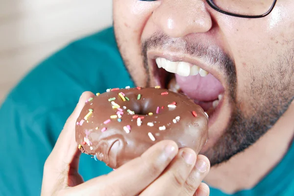 Man eating a donut Stock Photos, Royalty Free Man eating a donut Images ...