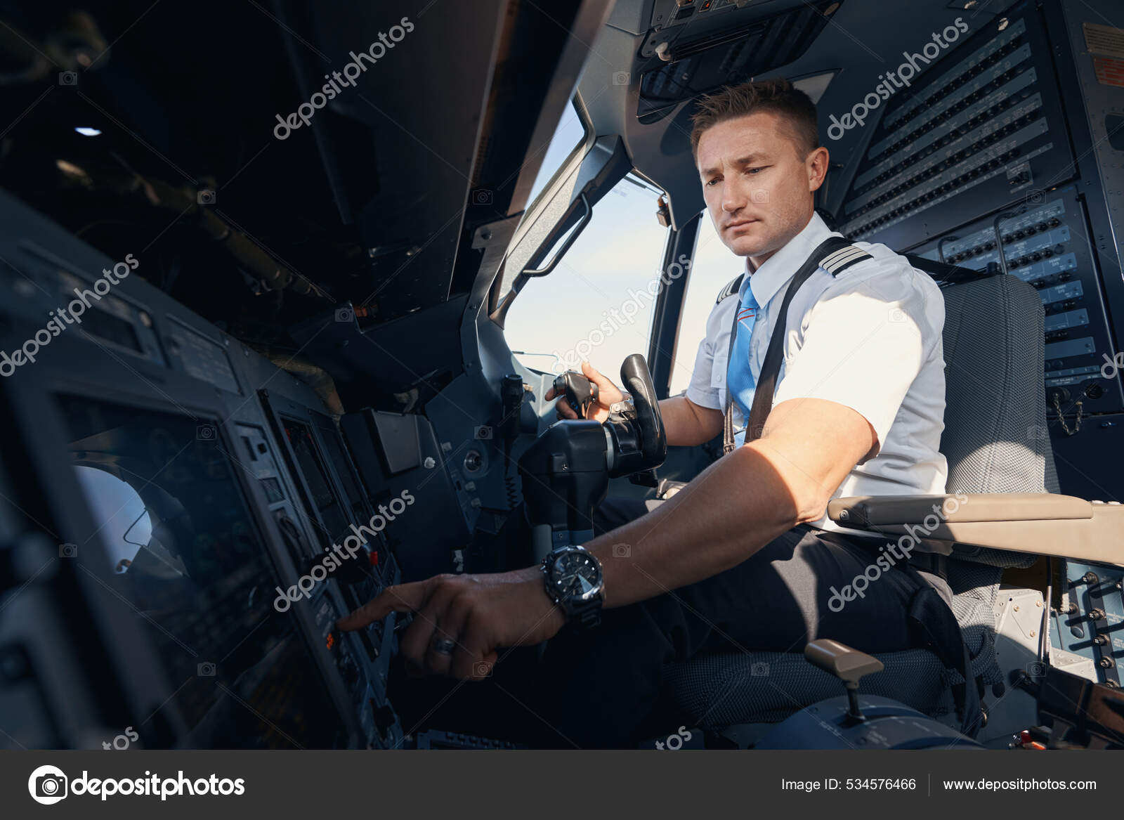 Man first officer pressing button on airplane control panel — Stock ...