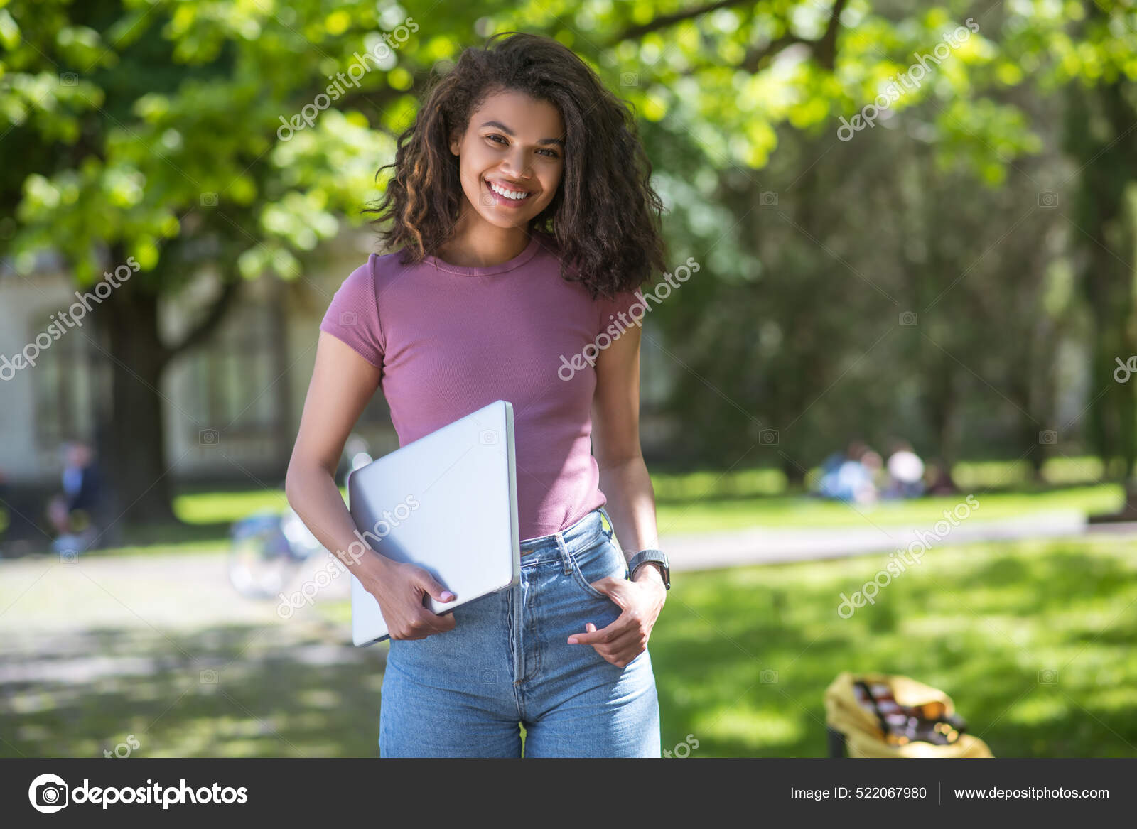 A pretty dark-skinned girl studying on the park Stock Photo by ©Dmyrto ...