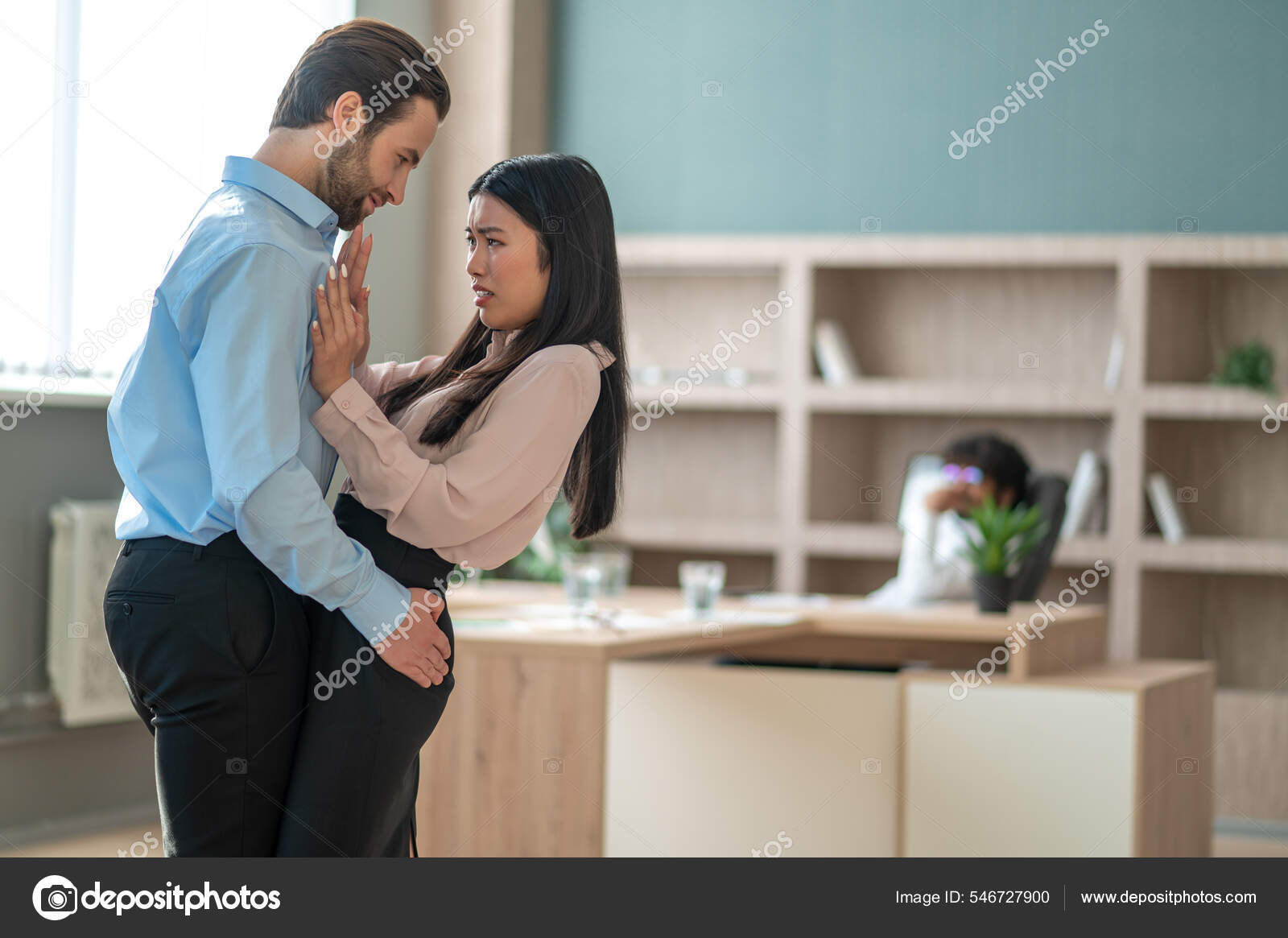 Man behaving improperly with his female colleague in the office — Stock ...