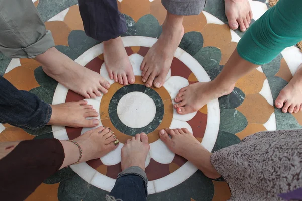 Feet forming a circle - Stock Image - Everypixel