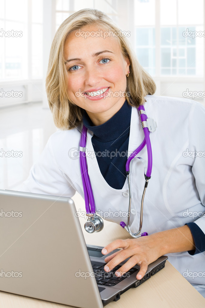 Doctor using laptop — Stock Photo © chagin #44751353