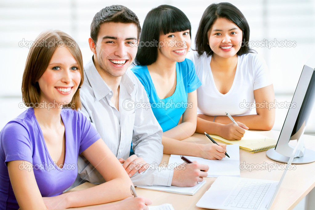 Happy students studying together Stock Photo by ©chagin 44825029