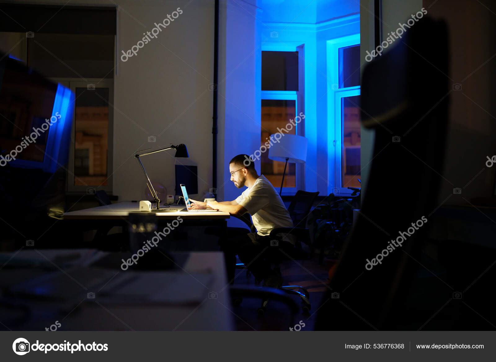 Workaholic man stay in office overtime prepare for business ...